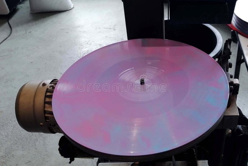 Close-up of a Phonograph Disk Record on the Edge Cutting Machine after ...
