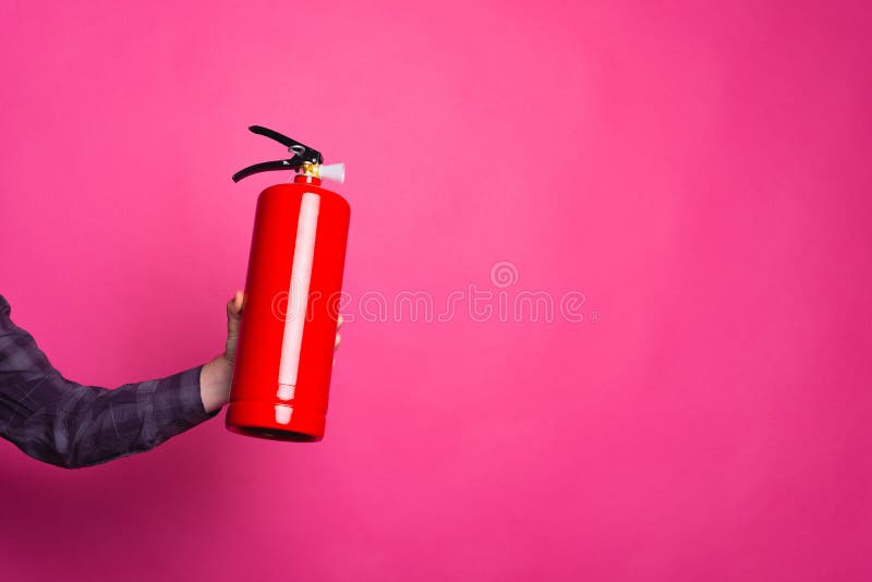 Close Up Photo of Fire Extinguisher Over Pink Background with Copyspace ...