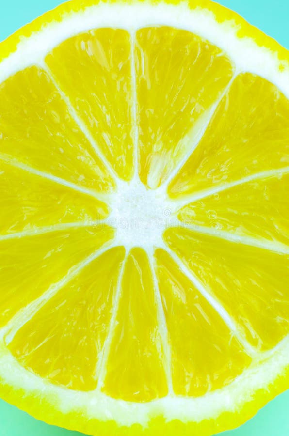 Close Up Photo of Lemon Texture on the Blue Background. Fruit Cut in ...