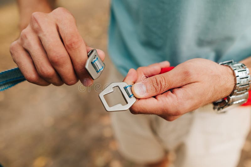 Close-up Photo of Men`s Hands are Connected by Slings with Hooks ...