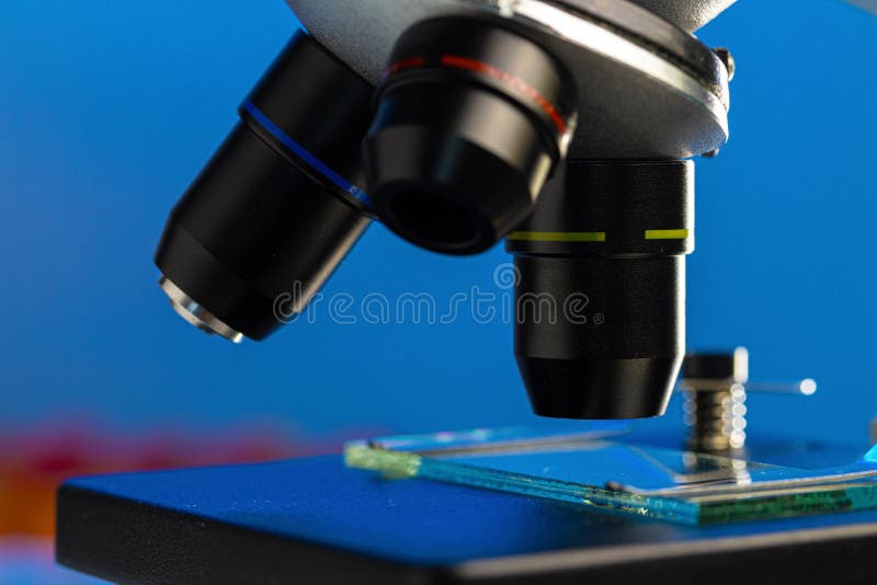 Close Up Photo of a Microscope Lenses Examining Glass Sample Stock ...