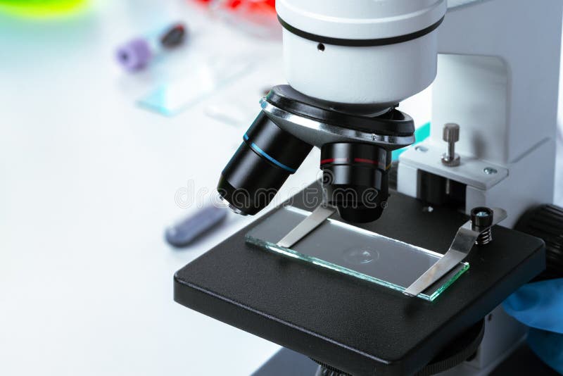 Close Up Photo of a Microscope Lenses Examining Glass Sample Stock ...