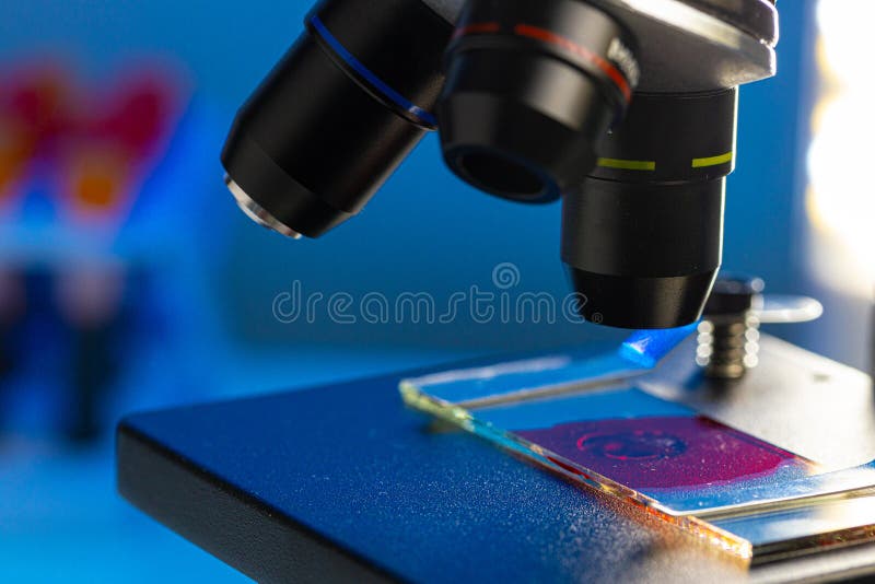 Close Up Photo of a Microscope Lenses Examining Glass Sample Stock ...