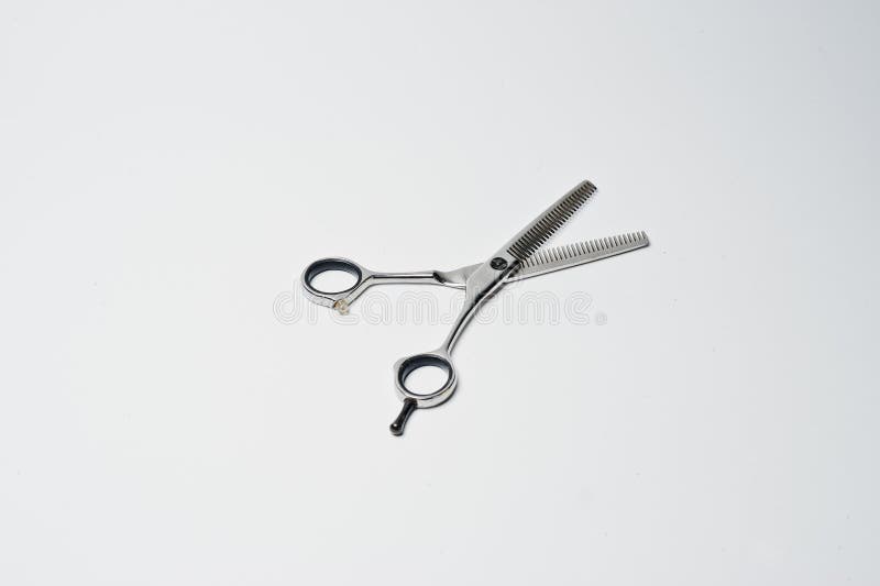 Close-up Photo of a Pair of Silver Scissors Laying on the White Stock ...