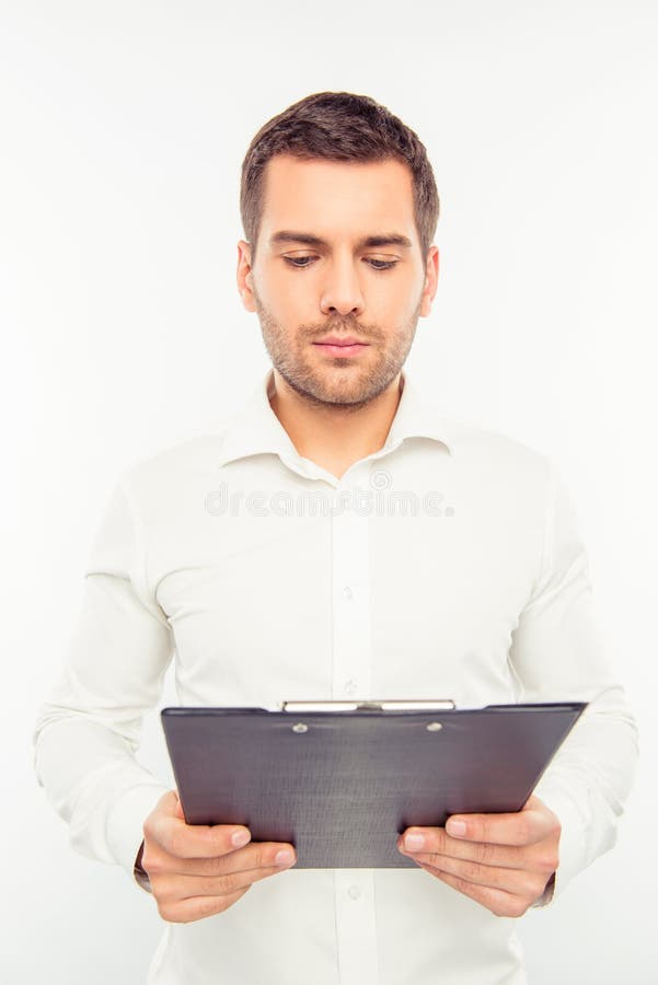 Close Up Photo of Serious Young Man Holding a Folder Stock Image ...
