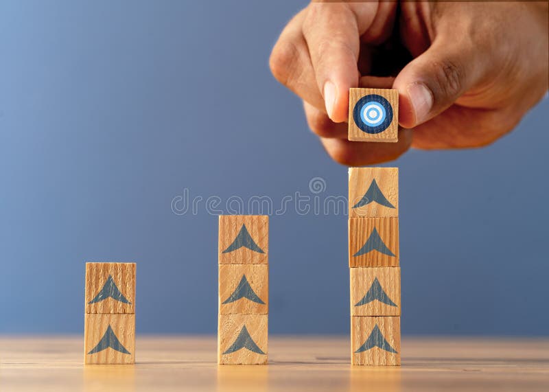 Close Up Photo of Stacked Wooden Blocks with Target Icon As a Symbol of ... Close Up Photo of Stacked Wooden Blocks with Target Icon As a Symbol of ...