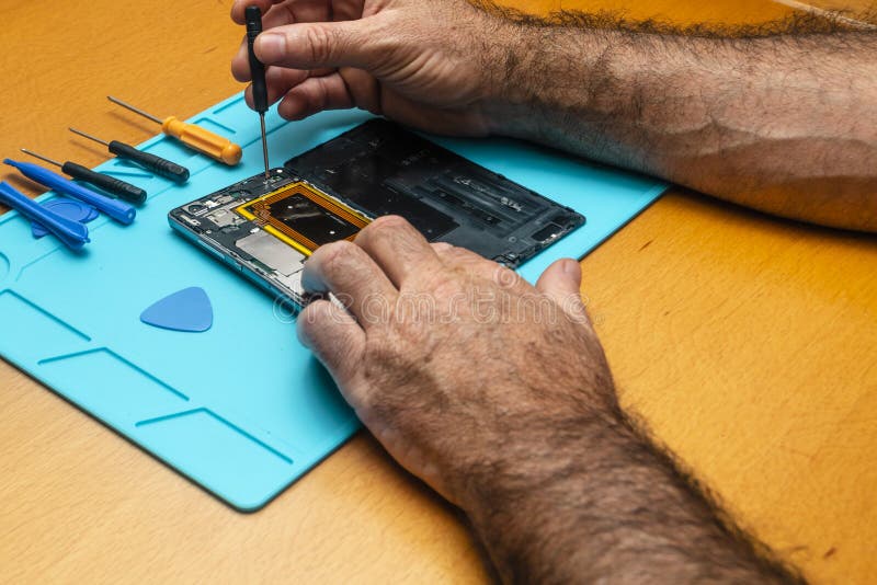 Close-up Photo of Technician Hand Repairing Cellphone Stock Photo ...