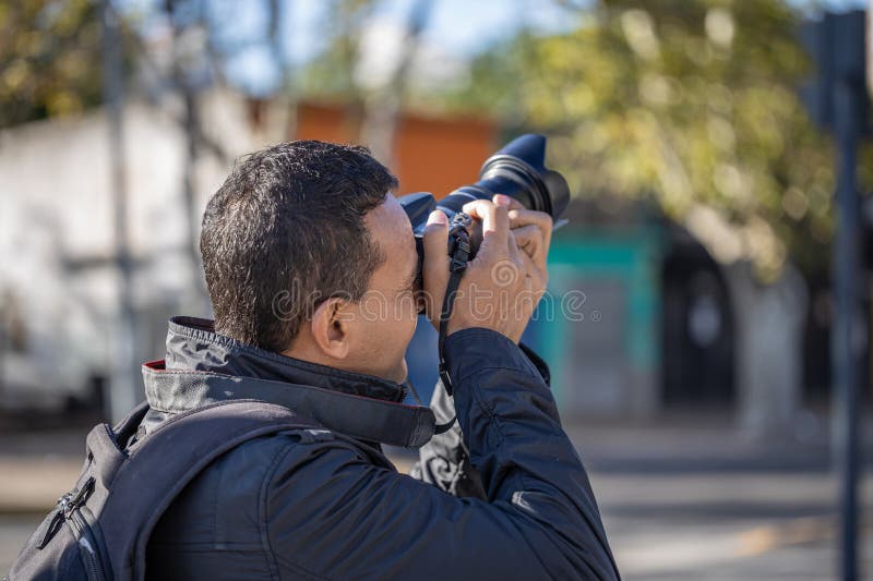 Close-up of a Photographer Taking a Picture Seen from Behind Stock ...