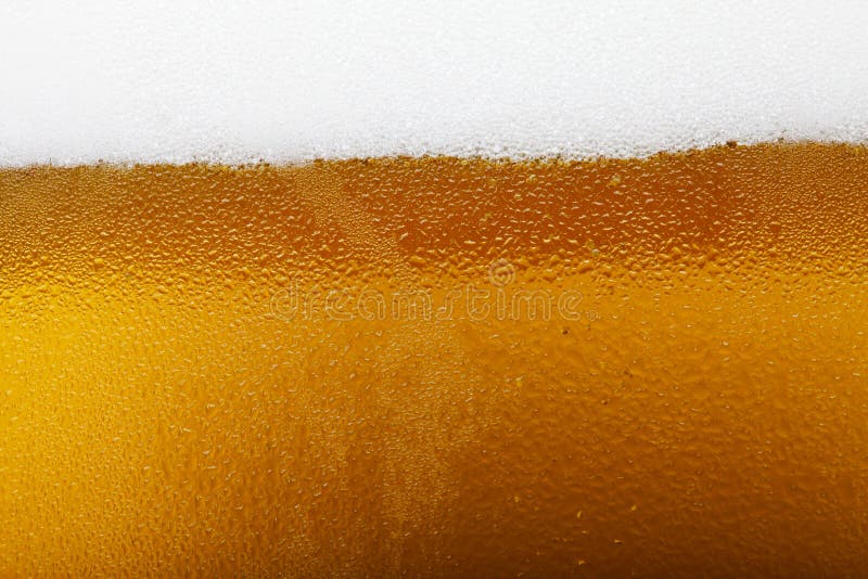 Close-up Picture of a Beer with Foam and Bubbles, Background Stock ...