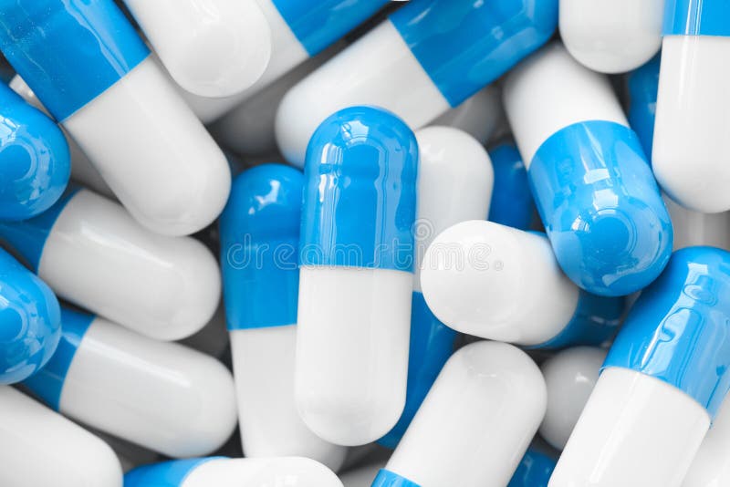 Close Up Picture of Blue and White Capsules. Stock Photo - Image of ...