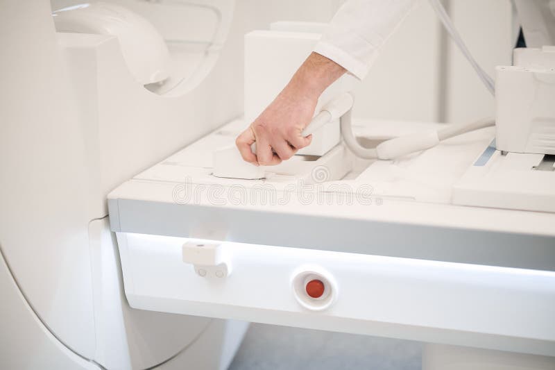 Close Up Picture of Doctors Hands Preparing MRI Scanner Stock Photo ...
