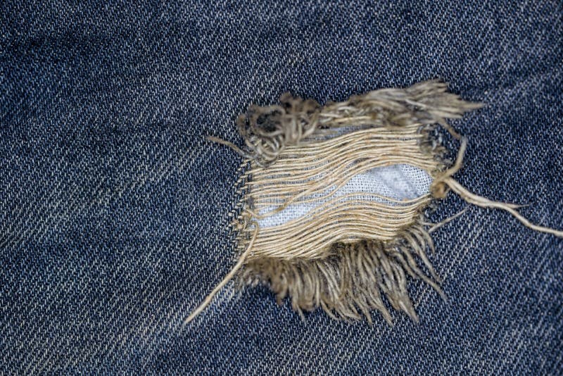 Close-up Pictures of the Surface of the Old Jeans Fabric and the Tear ...