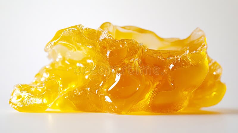 A Close Up of a Piece of Yellow Jelly on a White Surface Stock Photo - Image of shiny, piece ...