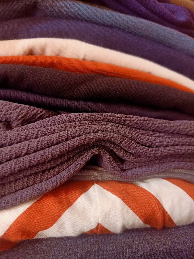 Close Up of a Pile of Assorted Ironed and Folded Clothes Stock Photo ...