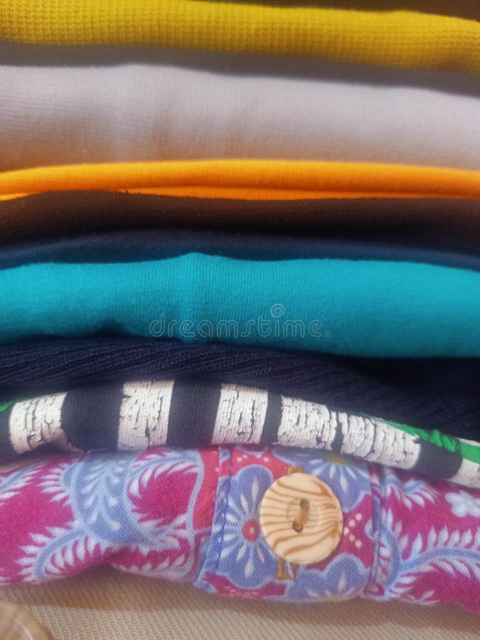 Close Up of a Pile of Assorted Ironed and Folded Clothes Stock Image ...