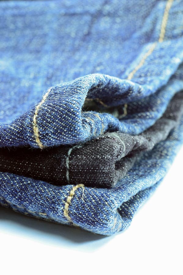 Close Up of a Pile of Denim Jeans Stock Image - Image of denim ...