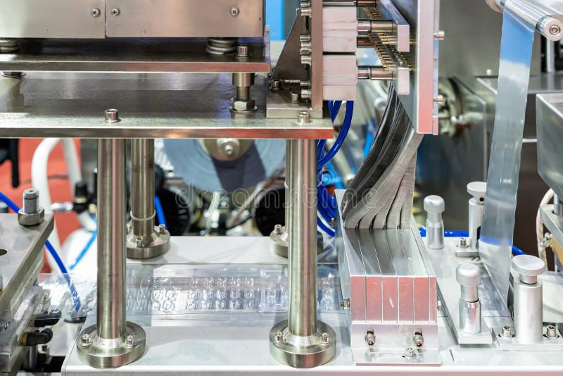 Close Up Plastic Film after Forming and Material Loading Unit or ...