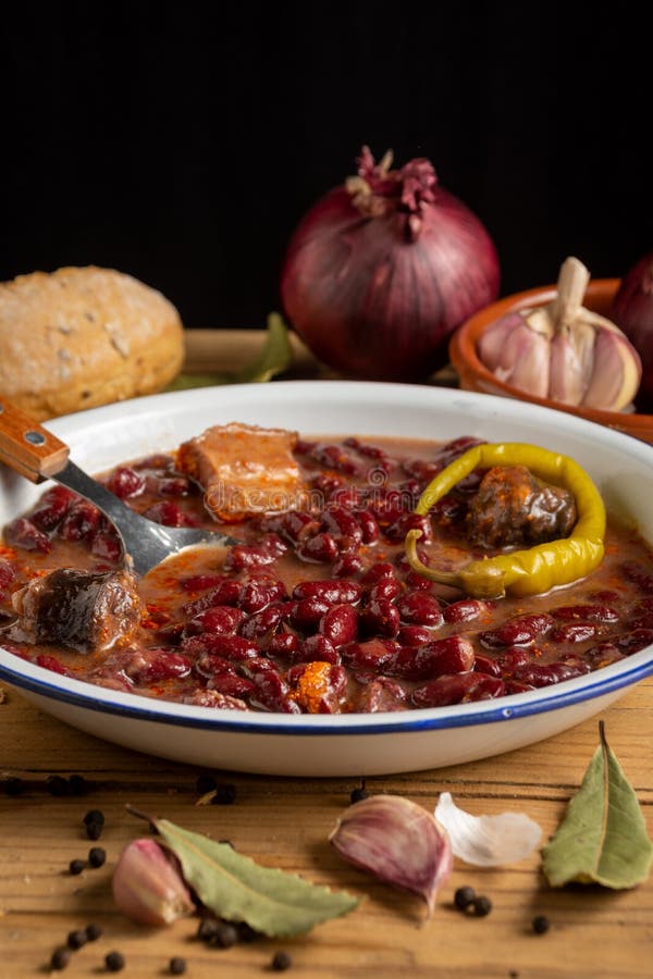 Close-up of Plate of Basque Beans with Spoon on Rustic Table with ...