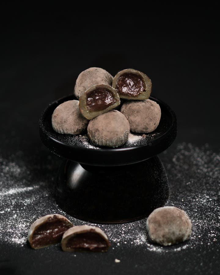 A Close-up of a Plate of Chocolate Mochi Stock Image - Image of moti ...