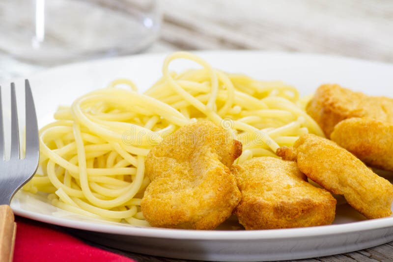 A Plate of Spaghetti with Chicken Nuggets Stock Image - Image of ...