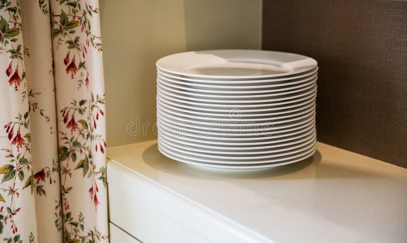 Close Up of Plates on Cupboard Shelf Stock Photo - Image of restaurant ...
