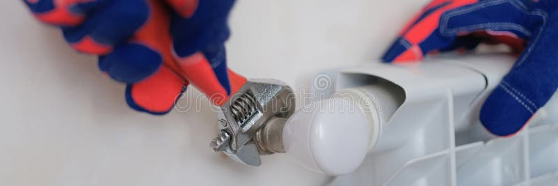 Plumber Hands in Protective Gloves Installing Heating Radiator Stock ...