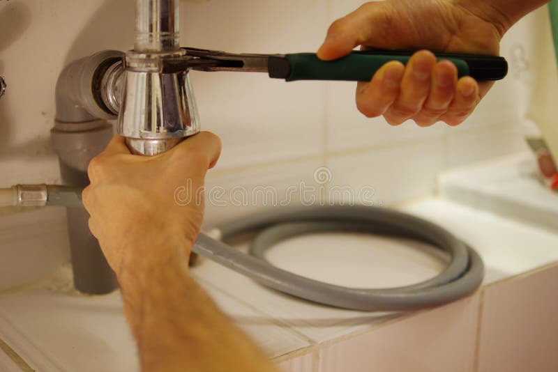 Plumber fixing drain stock photo. Image of sink, employee - 207673834