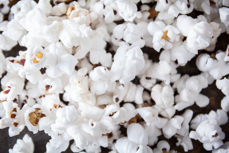 Close Up of Popcorn Spilled Out on a Wooden Table with Selective Stock ...