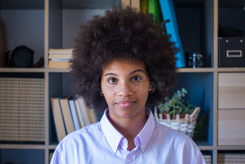 Close Up Portrait Of Attractive Dark Skinned Young Woman With Curly