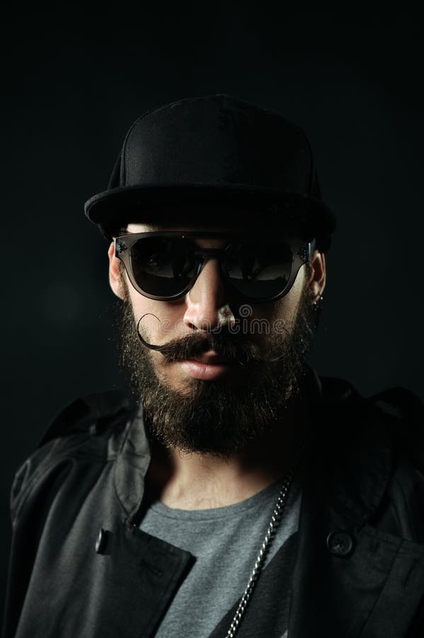 The Close-up Portrait of Bearded Man in a Fitted Hat Stock Photo ...