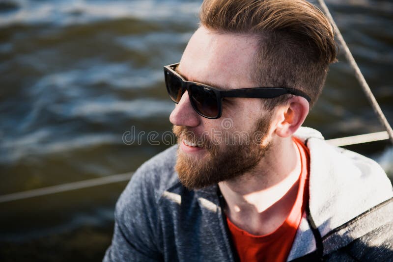 Close Up Portrait Bearded Man Model Wearing Sunglasses And Hoodie Looks