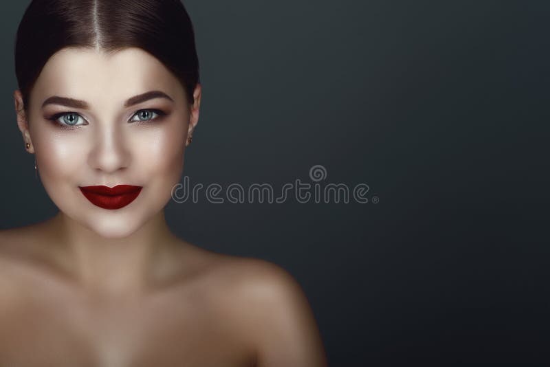 Portrait Of Beautiful Dark Haired Girl With Perfect Skin And Nude Make