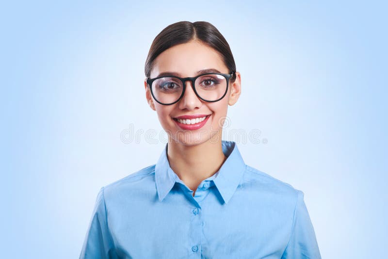 Portrait of a Beautiful Young Business Woman Standing Against Blue ... Portrait of a Beautiful Young Business Woman Standing Against Blue ...