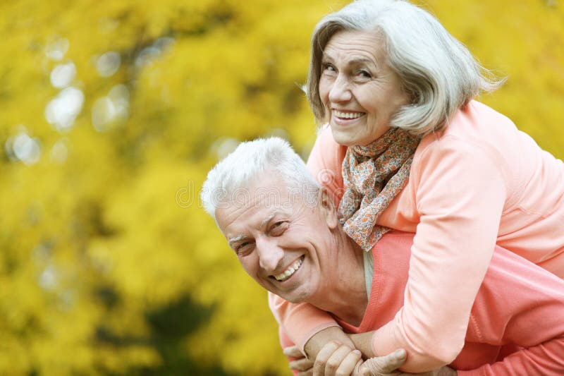 Close Up Portrait Of Caucasian Senior Couple In The Park Stock Image