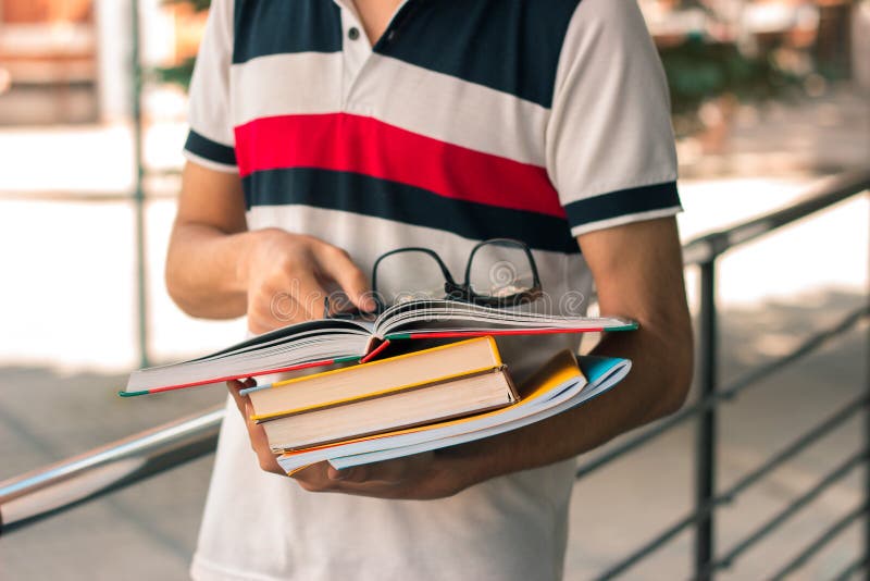Close-up Portrait of a Guy Who Holds a Book Stock Photo - Image of ...