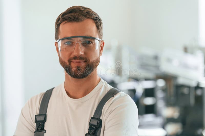 Close Up Portrait. Handsome Man is Working at the Factory of Creating ...