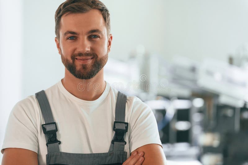 Close Up Portrait. Handsome Man is Working at the Factory of Creating ...