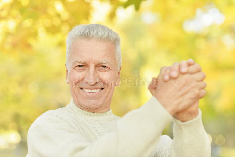 Happy Senior Man Showing Handshake in the Park Stock Photo - Image of ... Happy Senior Man Showing Handshake in the Park Stock Photo - Image of ...