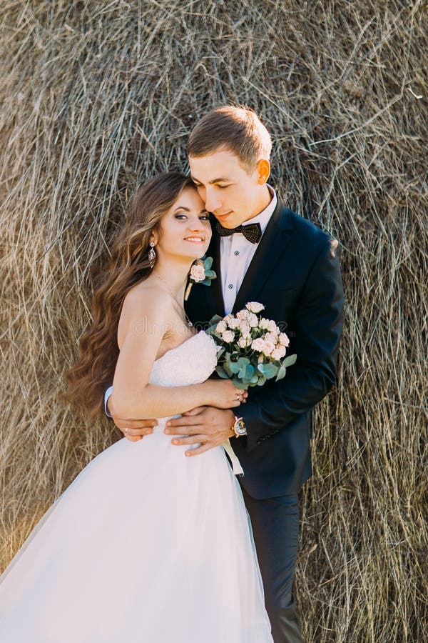 Close-up Portrait of Happy Young Married Couple Hugging on Haystack ...