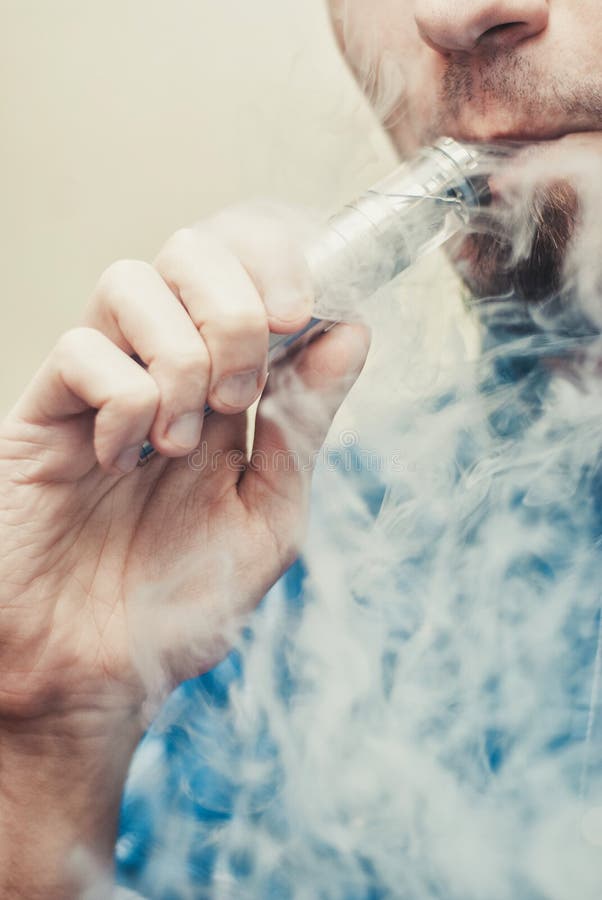 Close Up Portrait of a Man Vaping. Stock Photo - Image of holding, blue ...