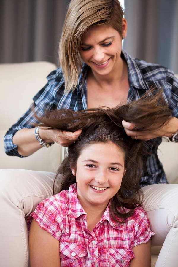 Close Up Portrait of Mother Combing Her Daughter Hair Stock Photo ... Close Up Portrait of Mother Combing Her Daughter Hair Stock Photo ...