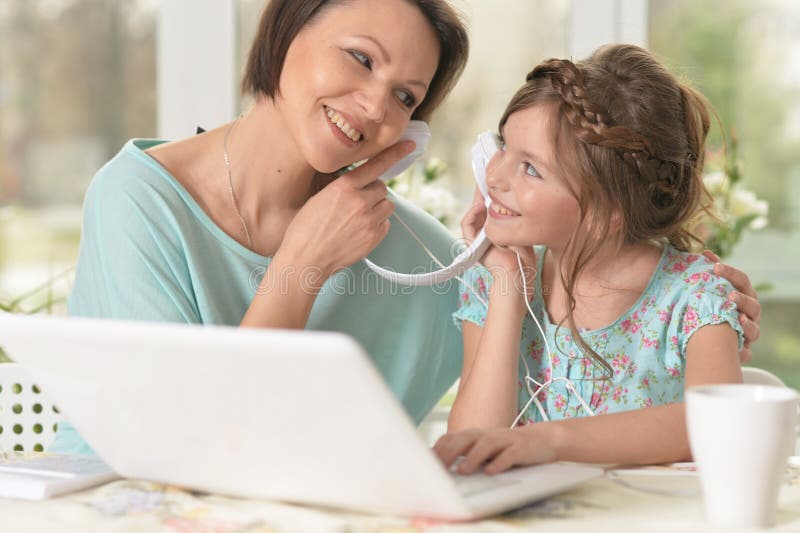 Portrait of Mother and Daughter Using Laptop Stock Photo - Image of ...