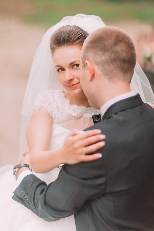 The Close-up Portrait of the Pretty Bride Hugging with the Groom. Stock ...
