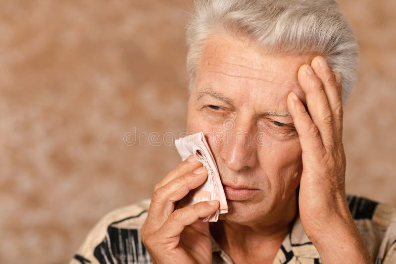 Close-up Portrait of Sad Sick Senior Man on a Beige Background Stock ...