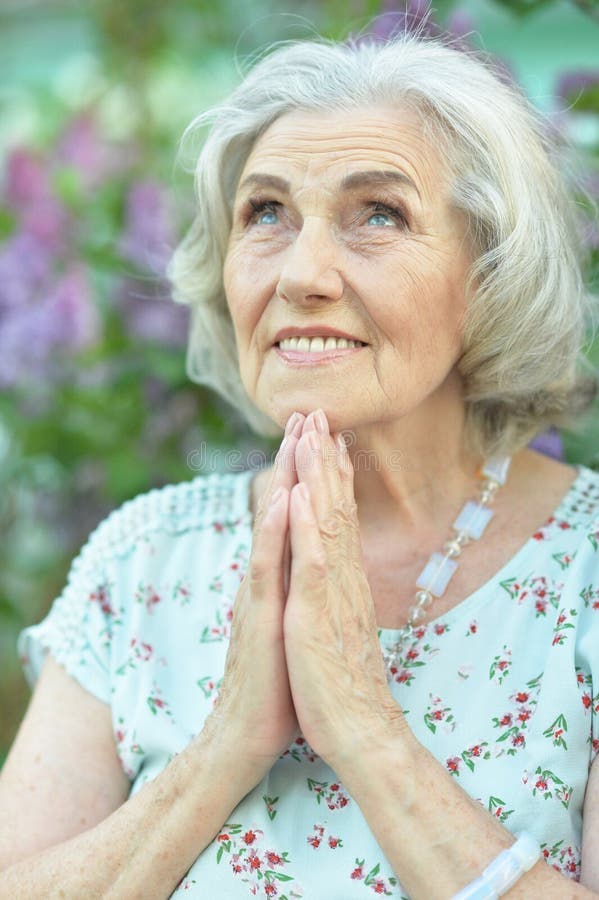 Close-up Portrait of Senior Beautiful Smiling Woman Praying Stock Photo ... Close-up Portrait of Senior Beautiful Smiling Woman Praying Stock Photo ...