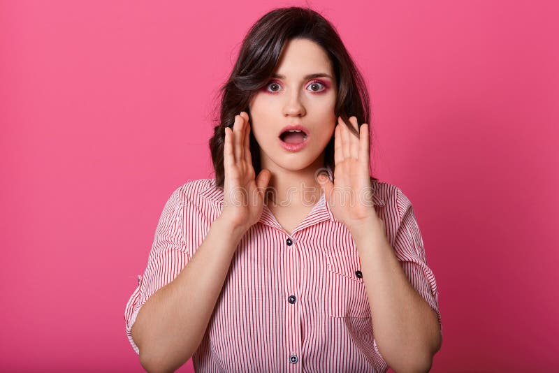 Close Up Portrait Of Shocked Girl With Her Mouth Opened Keeps Near