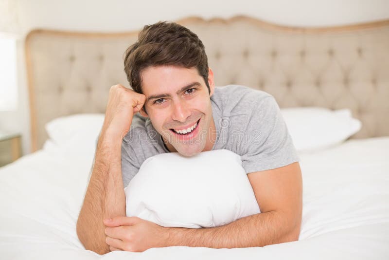 Close Up Portrait of Smiling Man Resting in Bed Stock Image - Image of ...