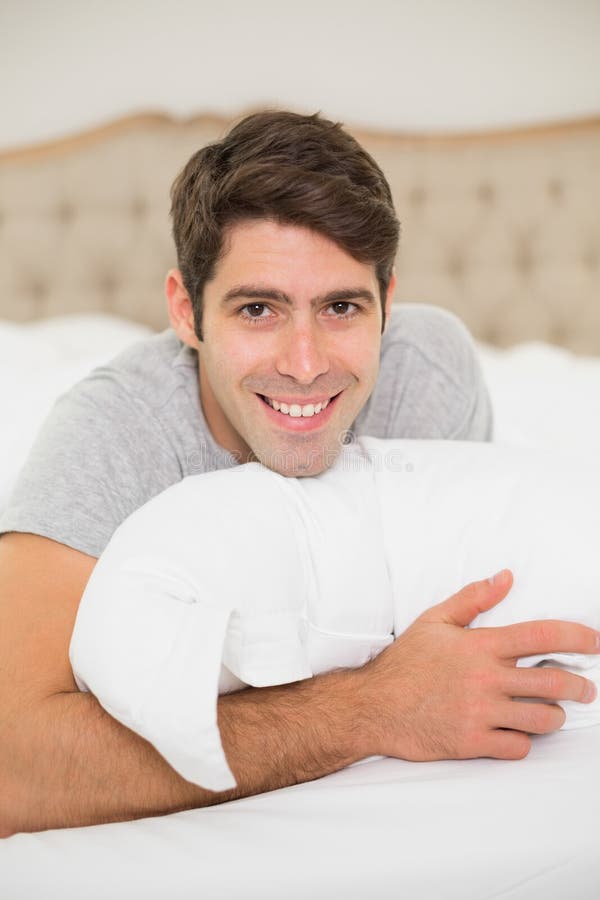 Close Up Portrait of a Smiling Man Resting in Bed Stock Image - Image ...