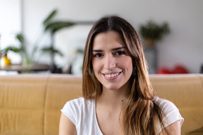 Close Up Portrait Of Smiling Young Adult Pretty Woman Looking At Camera