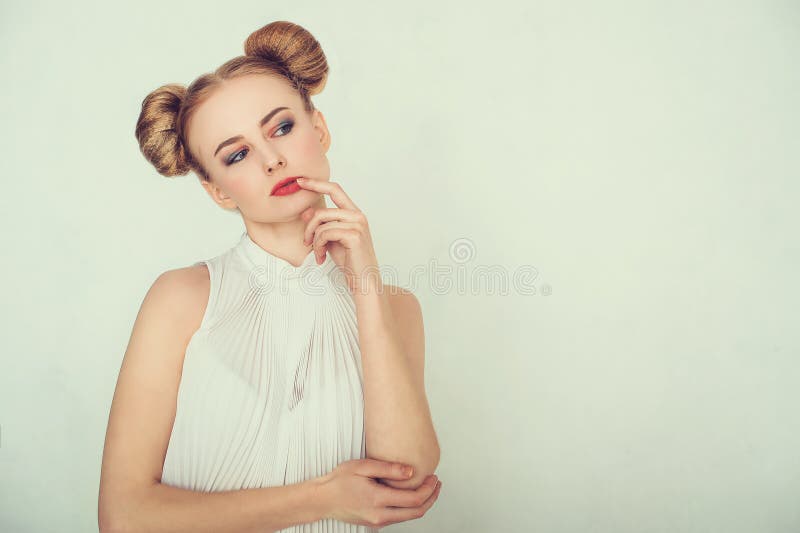 Close-up Portrait of Thoughtful Beautiful Girl. with Funny Hairstyle ... Close-up Portrait of Thoughtful Beautiful Girl. with Funny Hairstyle ...